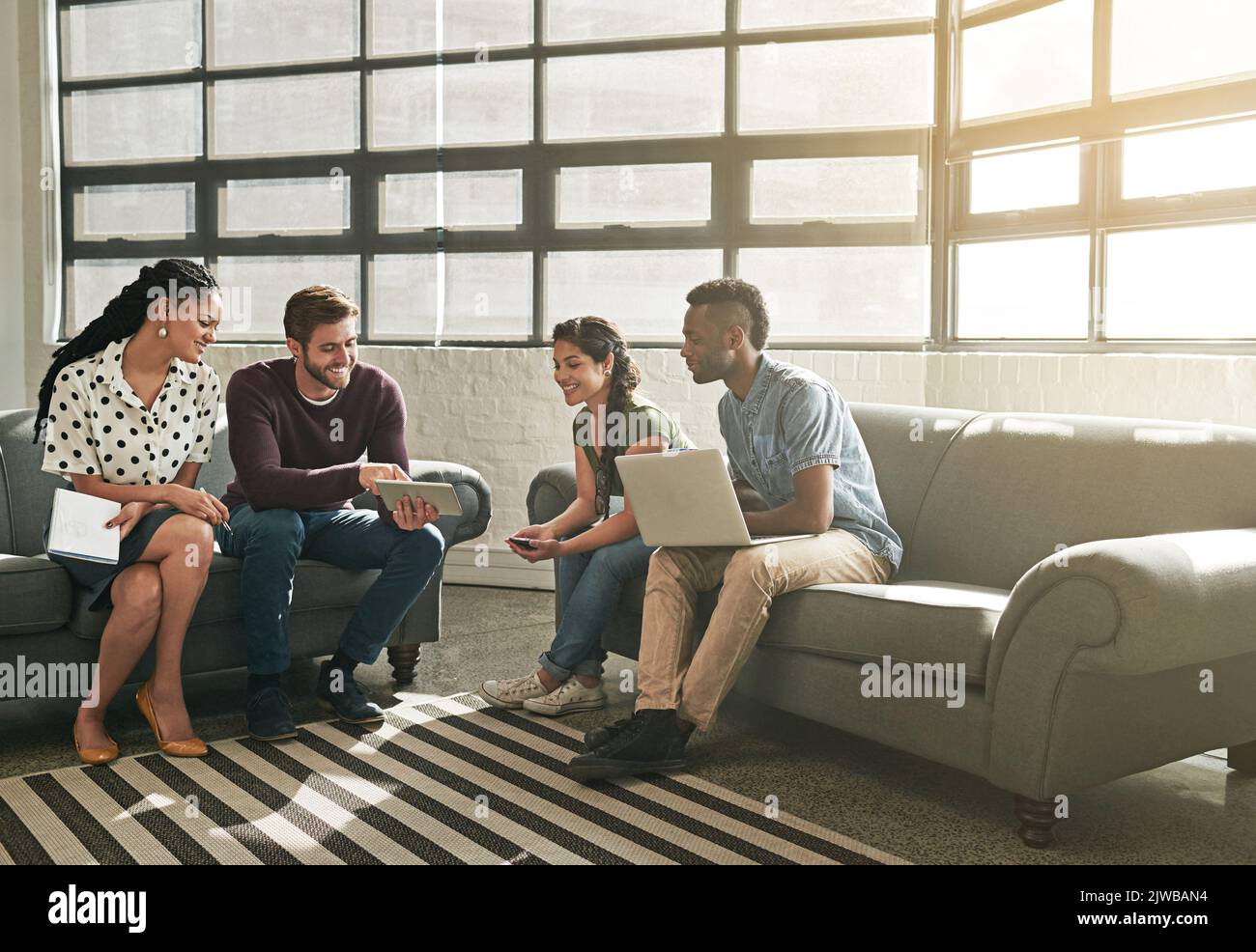 Effective teamwork gets the job done. a team of colleagues having a ...