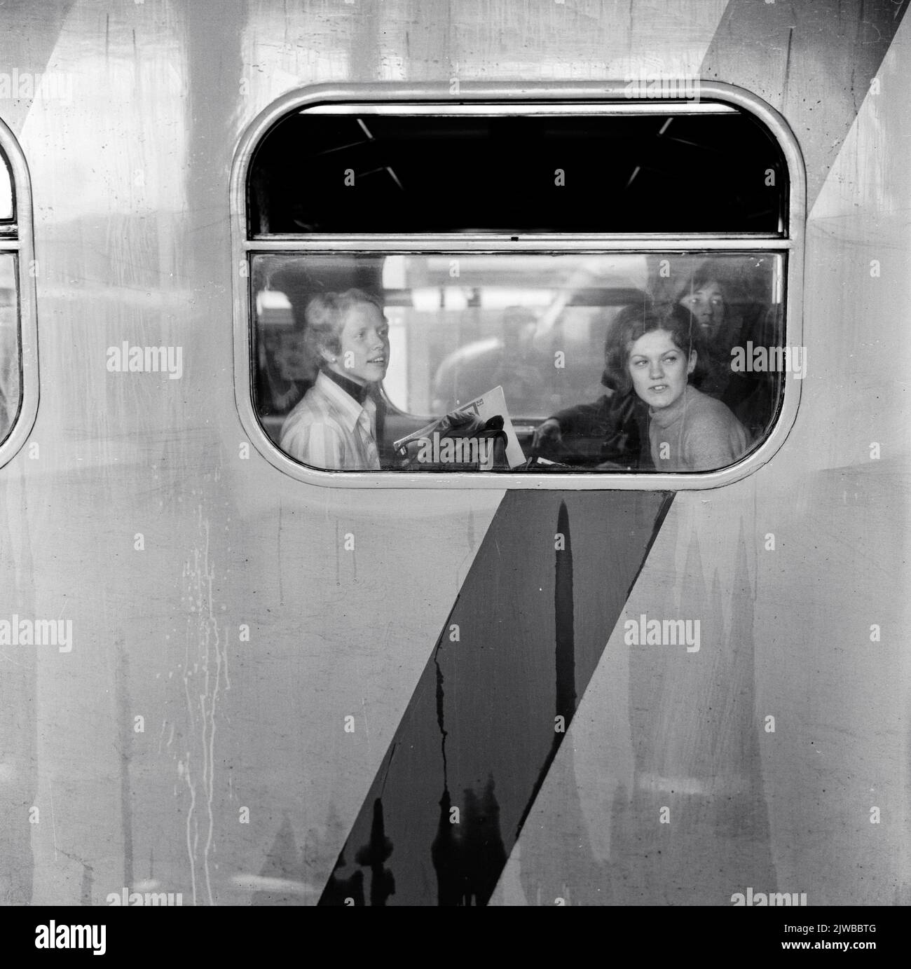 Image of some young women behind a train window Stock Photo - Alamy