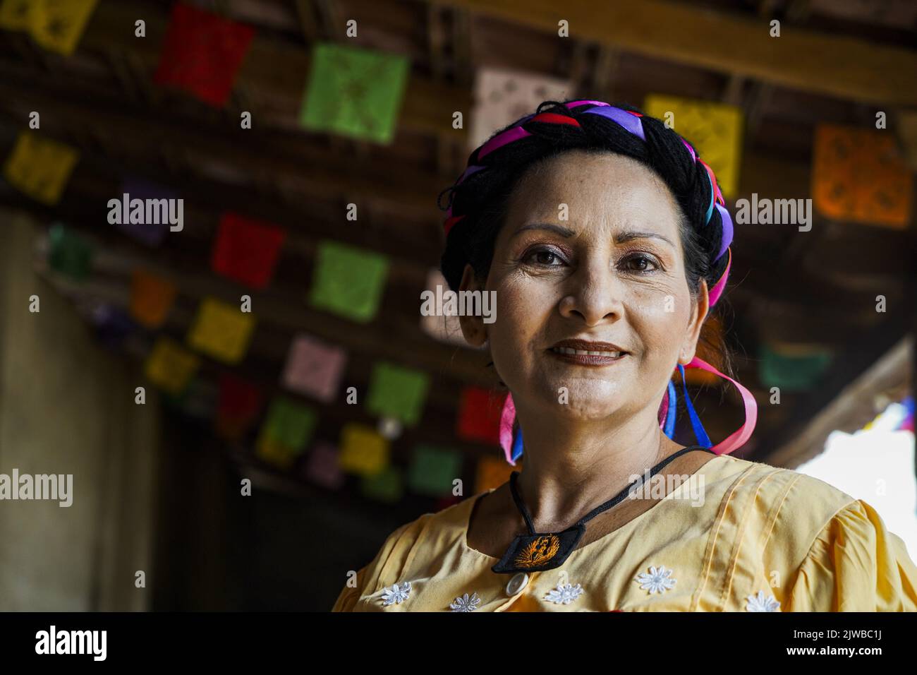 An indigenous woman poses for a photo during the celebration of ...