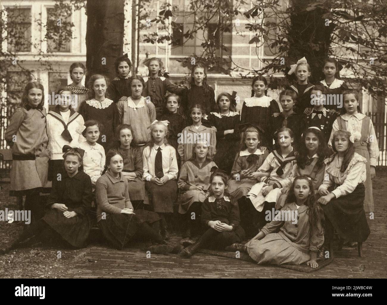 Group portrait with the girls from a class of an unknown school in ...