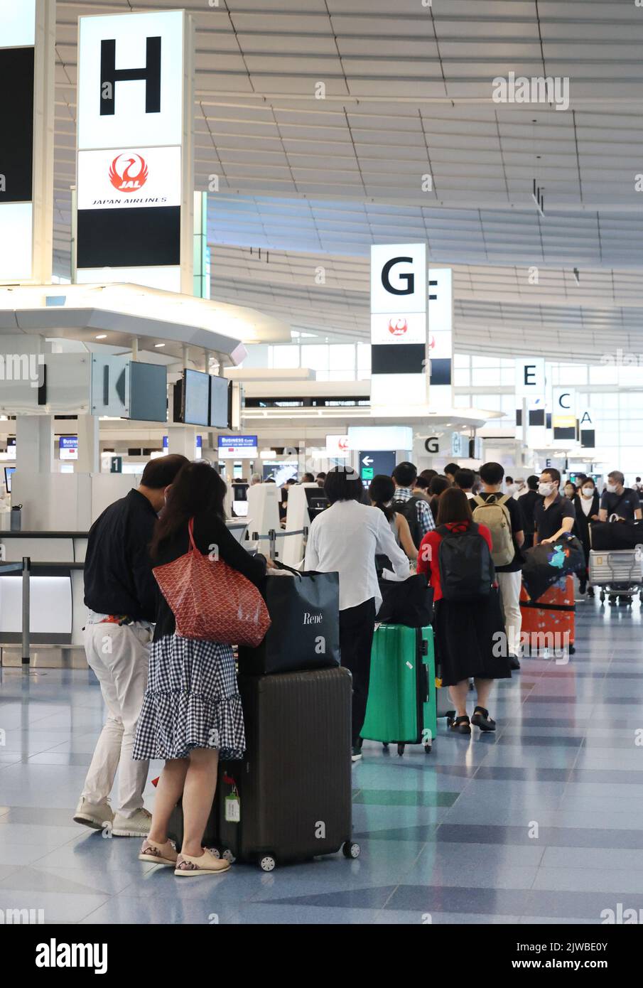 Tokyo, Japan. 5th Sep, 2022. Tourists check in an airline counter for ...
