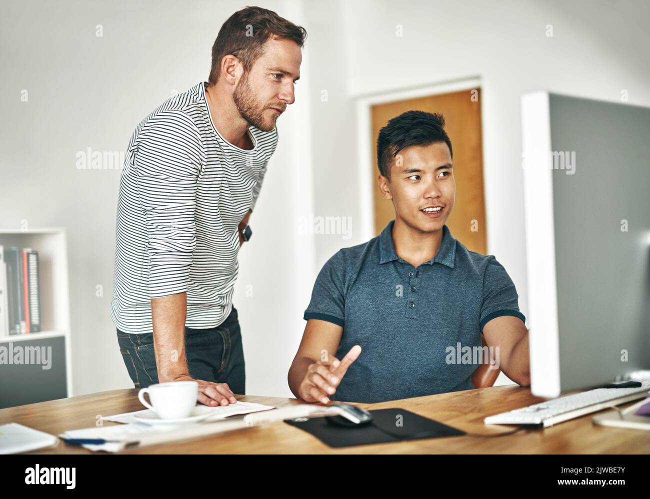 Adjusting designs to fit your needs. two designers working together on ...