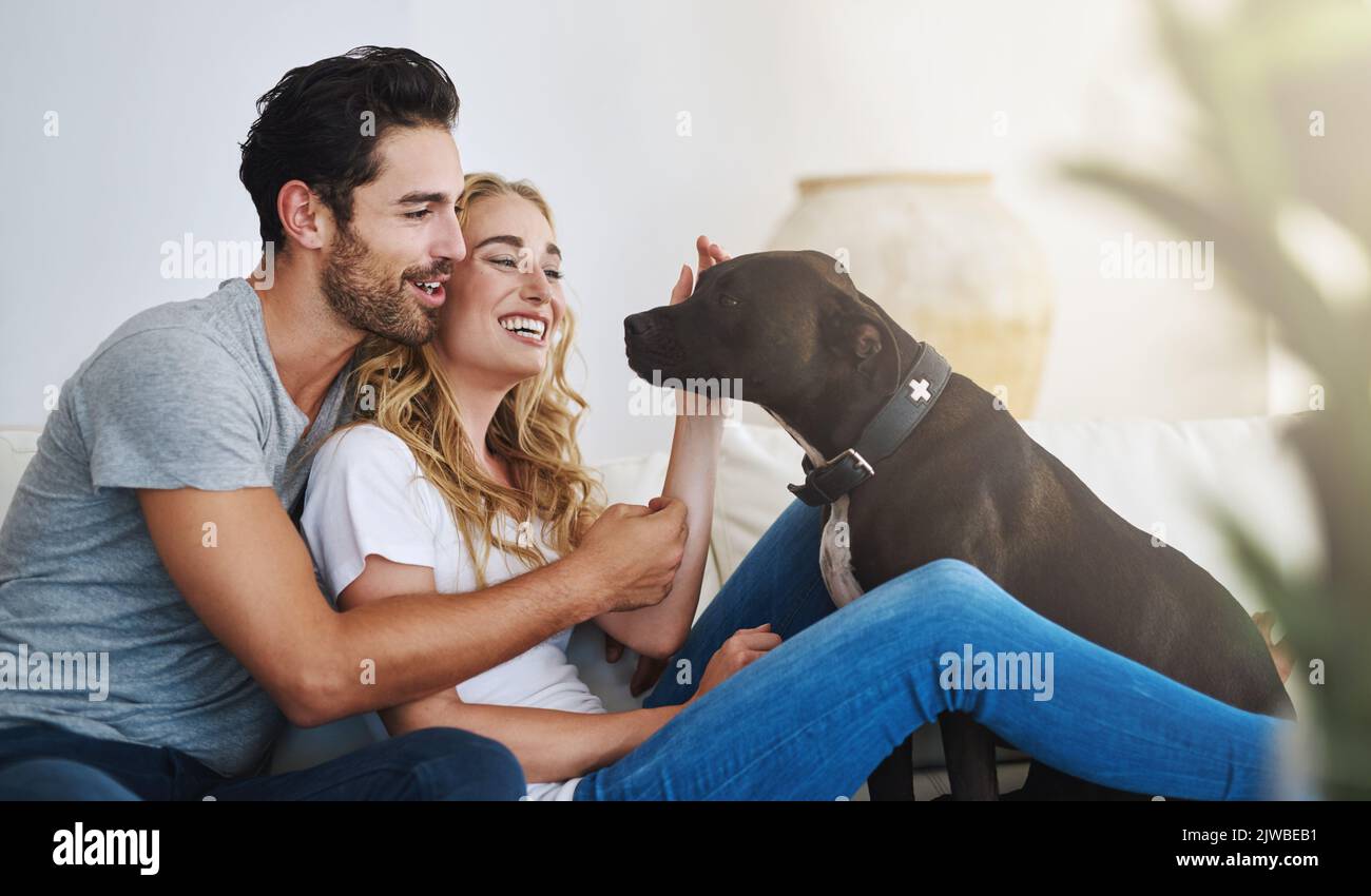 Lots of love in this home. a young couple relaxing at home with their ...