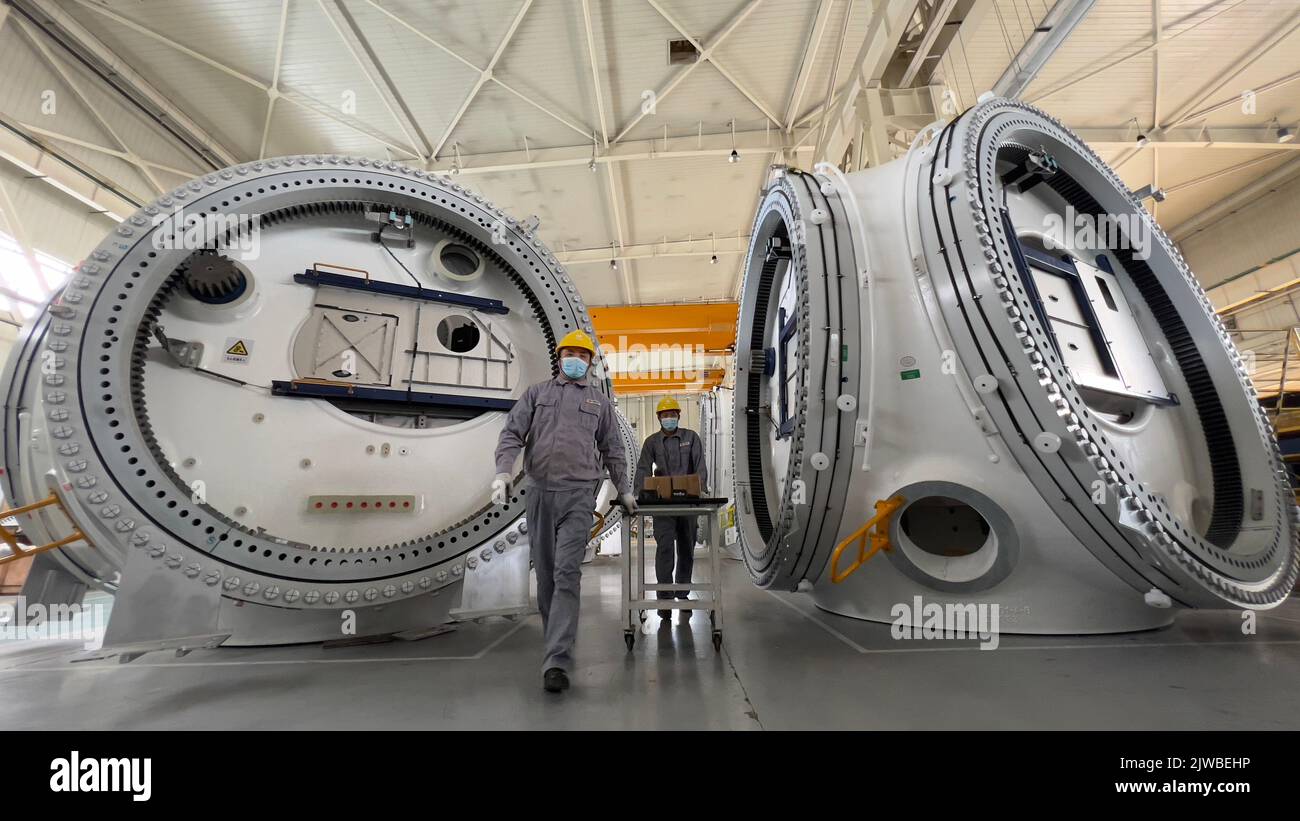 CHIFENG, CHINA - AUGUST 26, 2022 - Workers assemble a large wind ...
