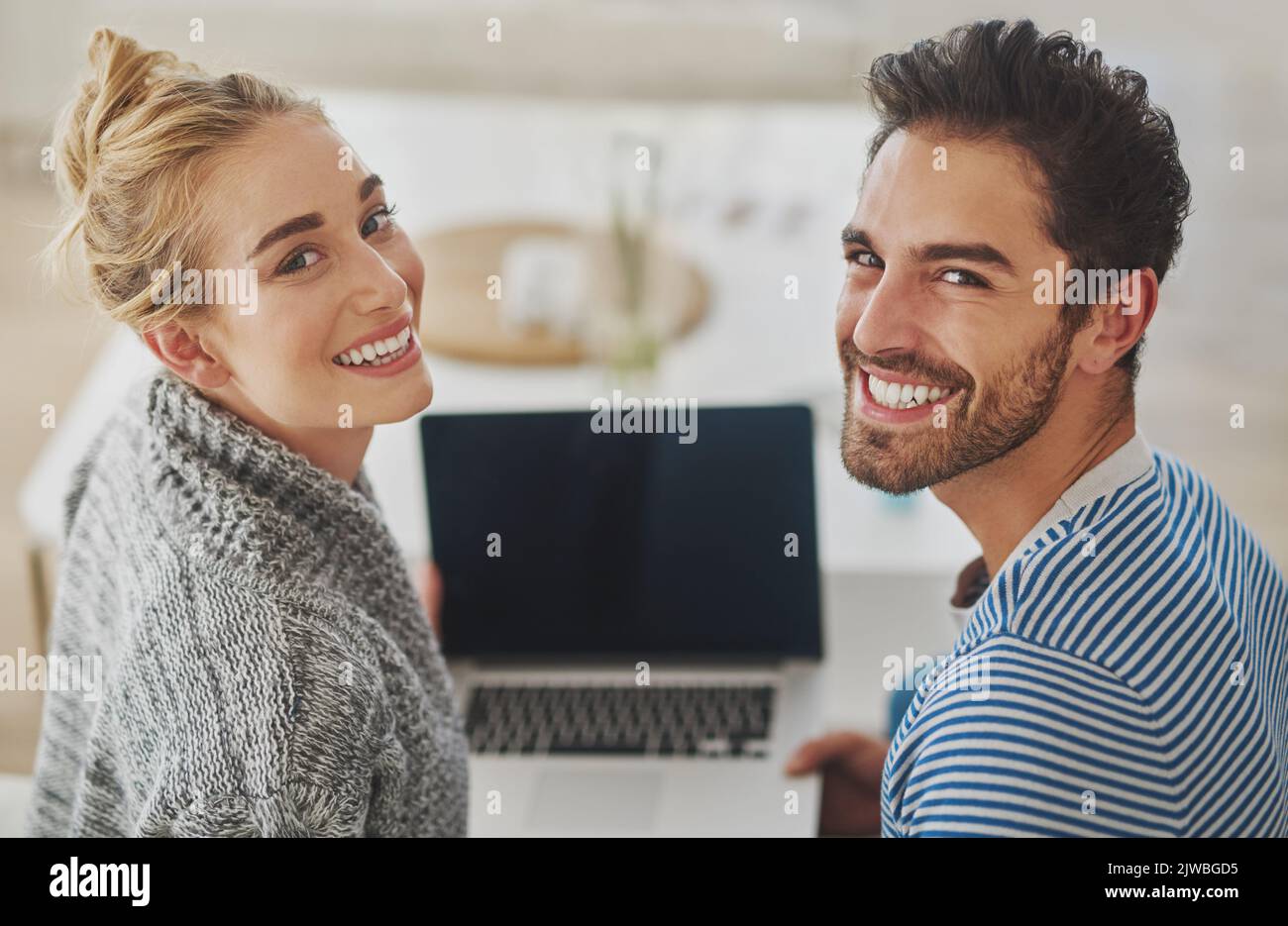 Our social media account is joint. a young couple using a laptop on ...