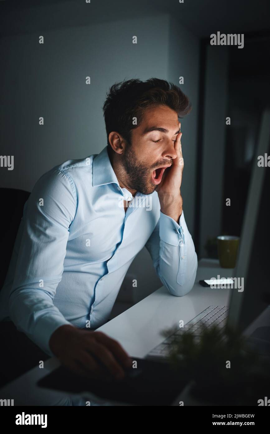 His brain is desperate to switch off for the day. a young businessman ...