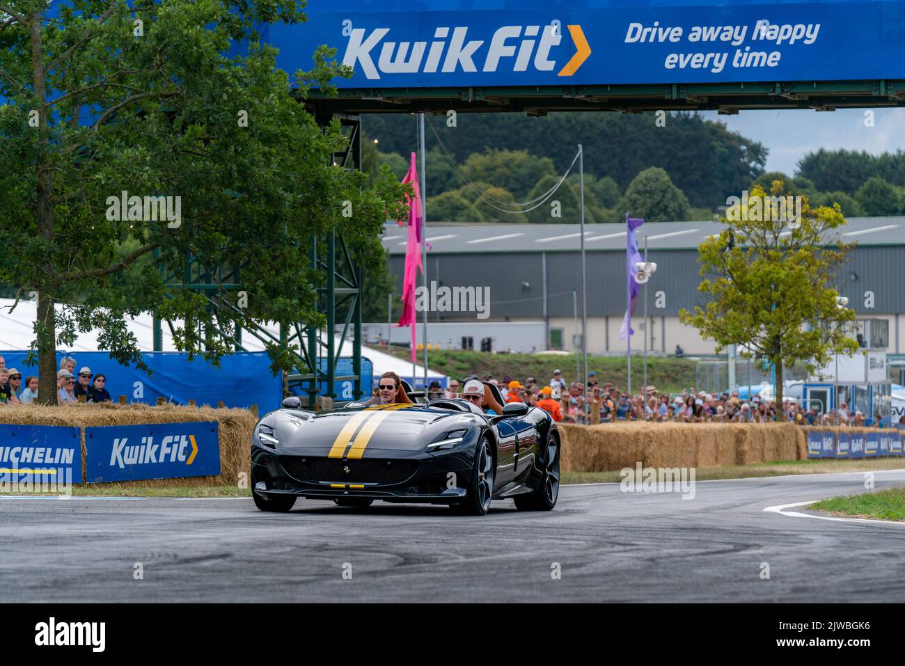 Jimmy Carr and Chris Evans Take a ride round the track at the Car fest ...