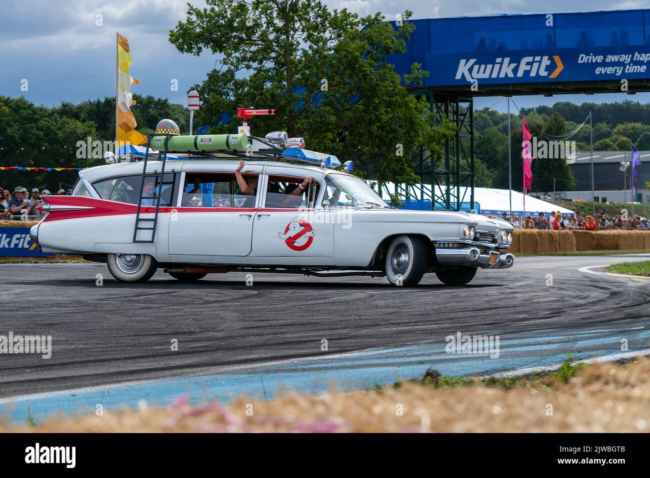 A film car replica from Ghostbusters drives round the Track at the Car ...