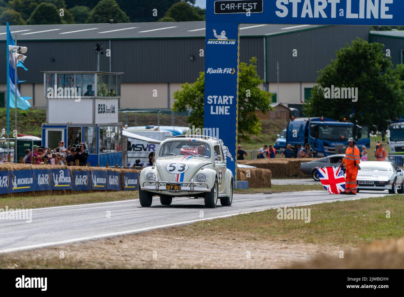 A car just past the start line on the track at the Car Fest South. Car ...