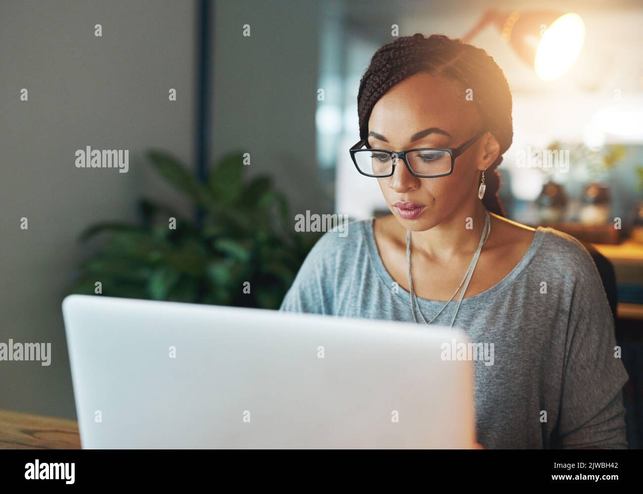 Woman working late on laptop hi-res stock photography and images - Alamy