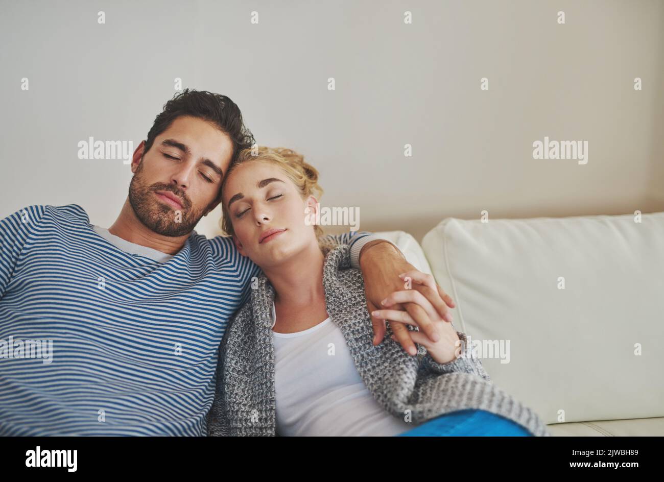 Nothing better than a Sunday afternoon nap. young couple having a nap ...