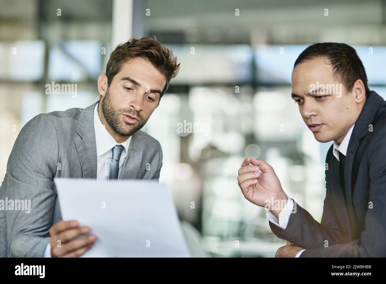 Going through the contract details. two colleagues looking over ...