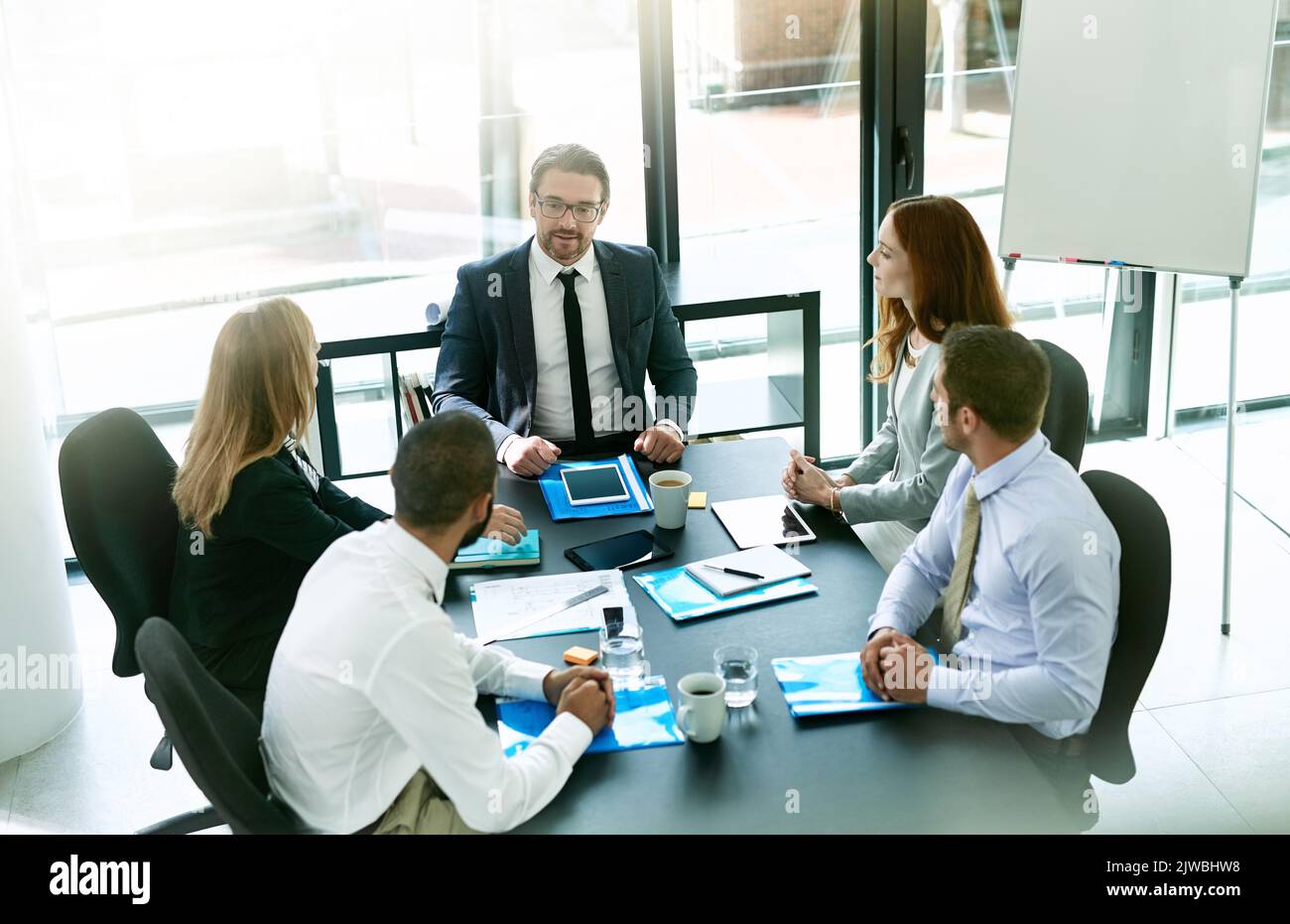 Team business people gathered hi-res stock photography and images - Alamy