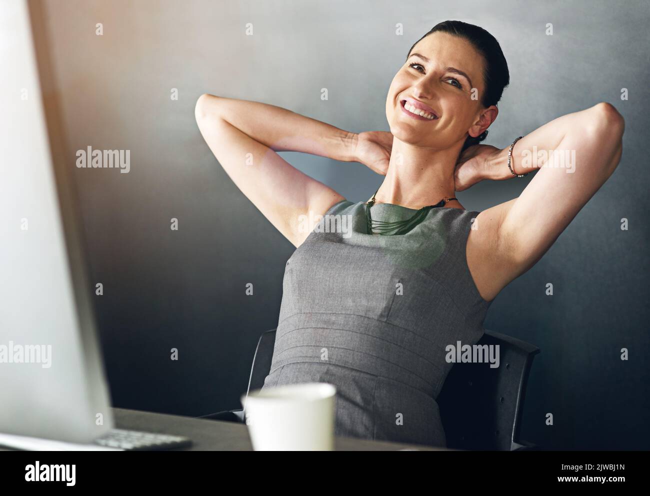 Shes on top of everything. a businesswoman sitting with her hands ...