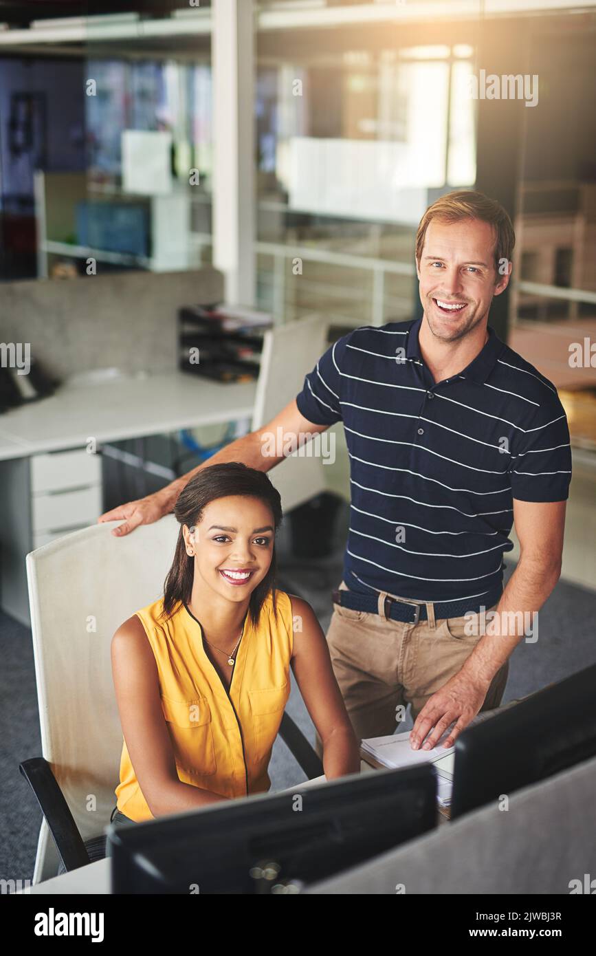 They owe their success to teamwork. Portrait of two smiling colleagues ...