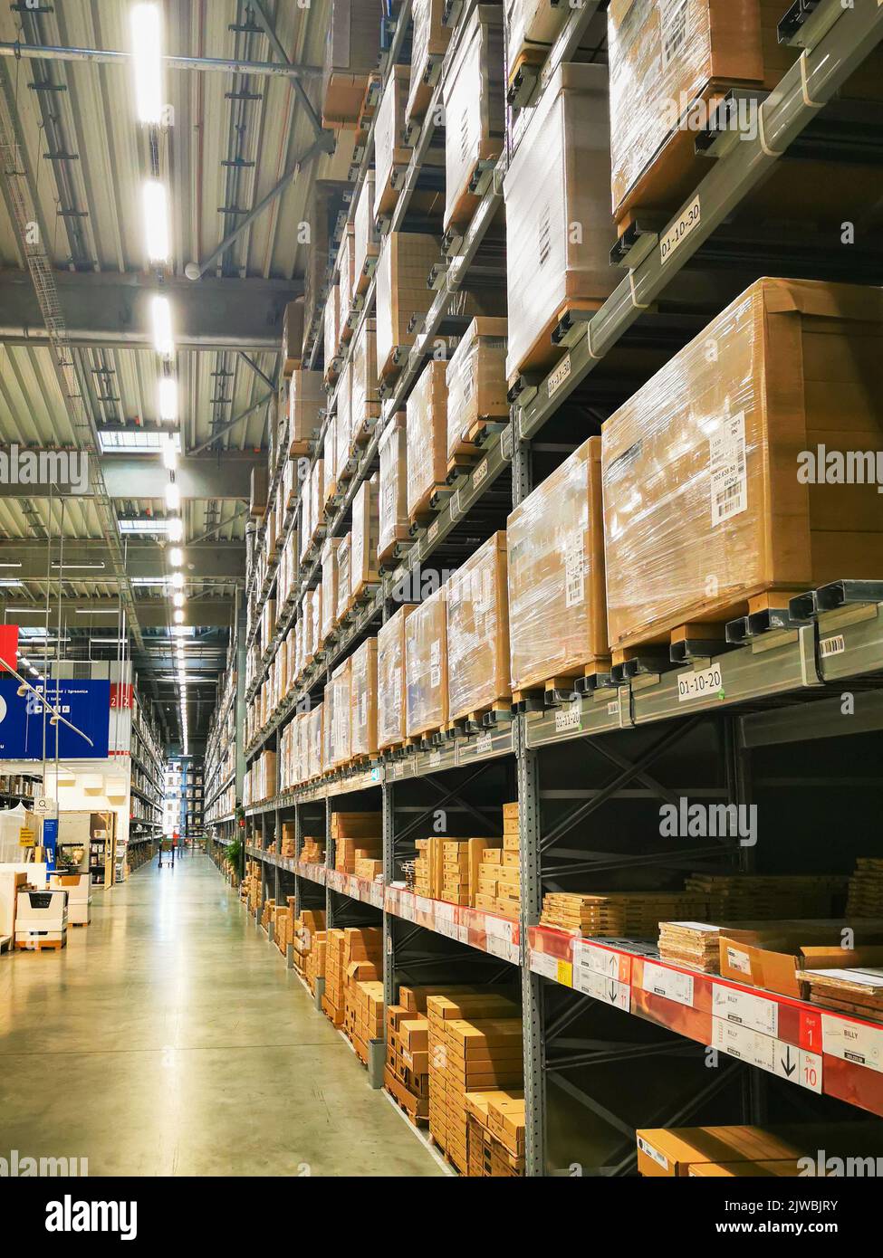 Huge warehouse-type store with large racks filled with packaged goods ...
