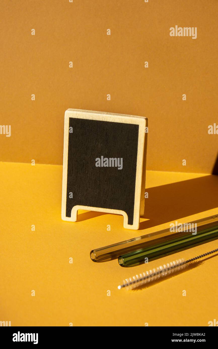 Reusable glass Straws in Glass with water on beige neutral background ...