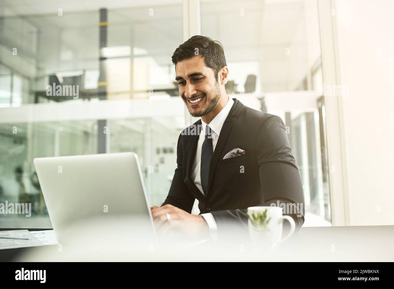 Using technology to improve his business growth. a businessman using ...