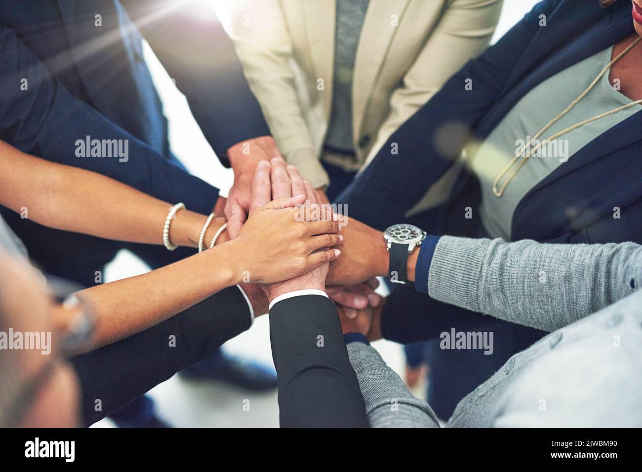 Success is the product of teamwork. corporate colleagues working ...