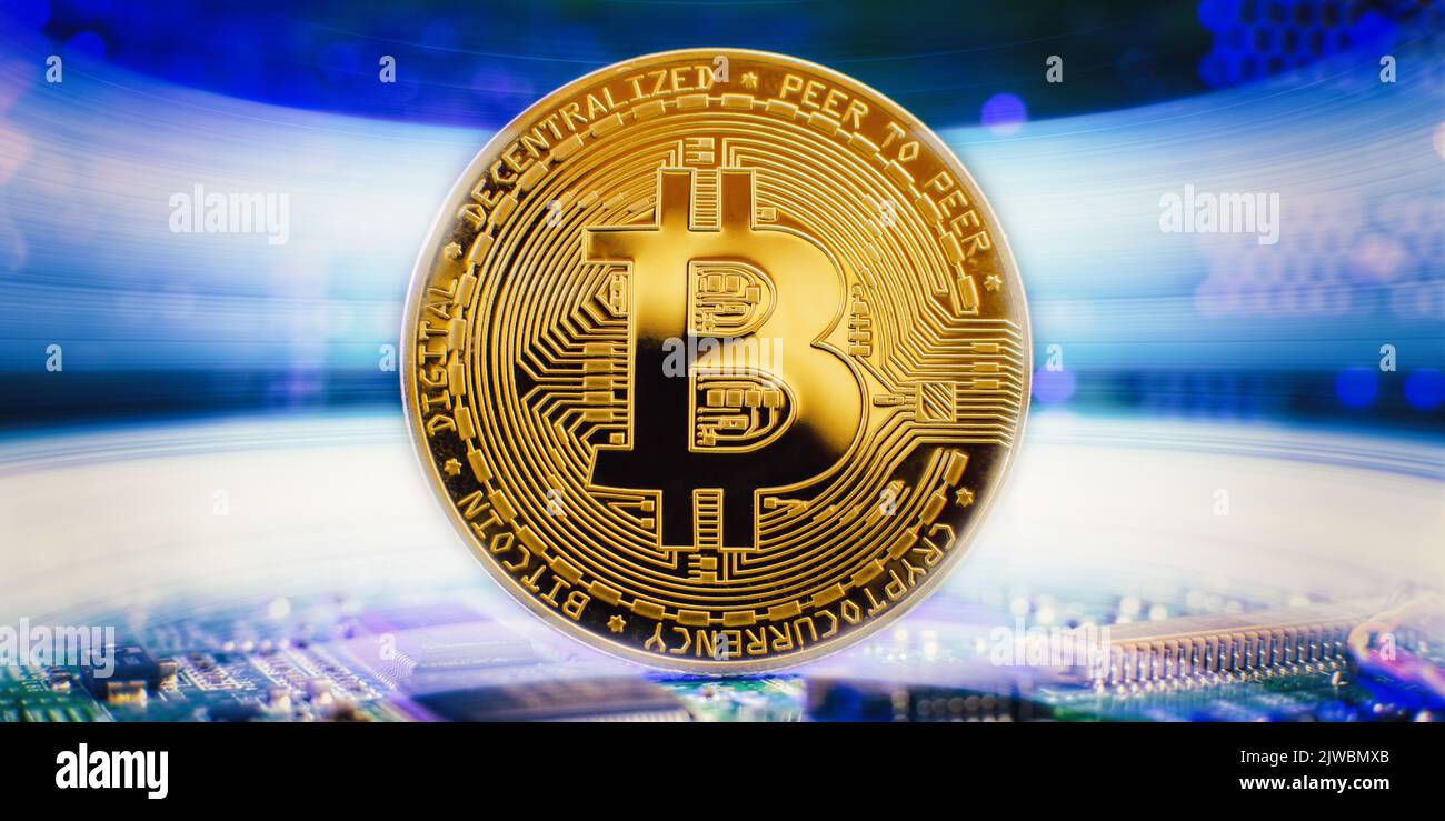 Blockchain technology bitcoin mining concept. Bitcoin golden coin on ...