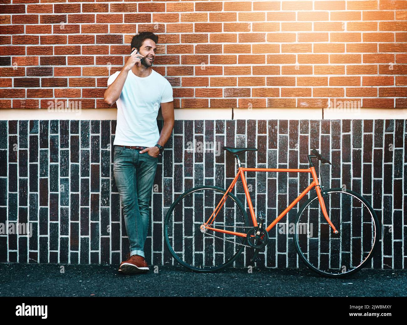 Everyones dialing his number. a handsome young man standing next to his ...