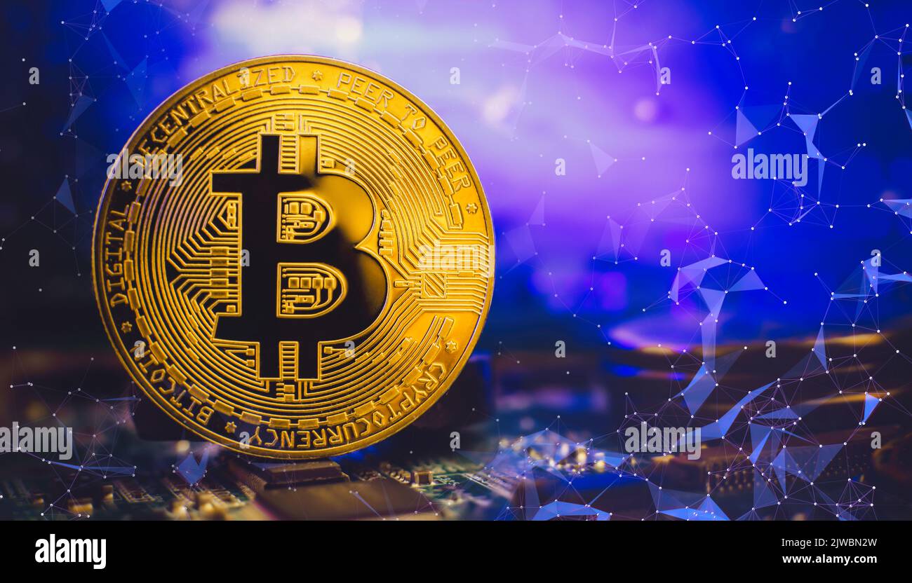 Cryptocurrency concept , Golden bitcoin on mainboard , The future of money. Computational ...