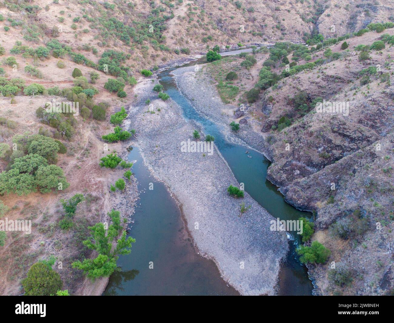 A splitting river between hills in the countryside, aerial shot Stock ...