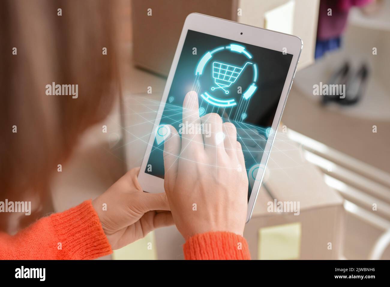 Woman with tablet computer making order online in shop, closeup Stock ...