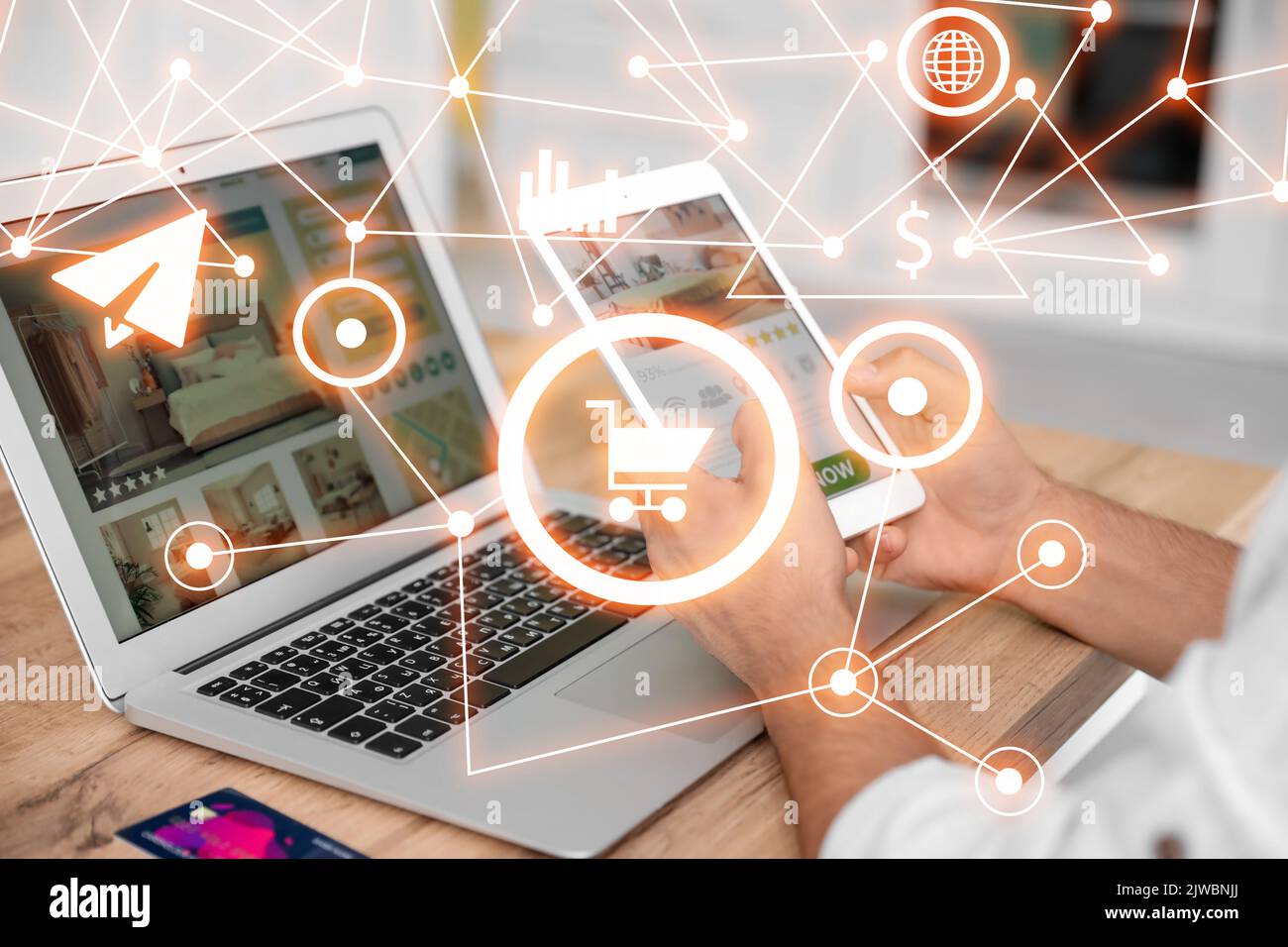 Man with tablet computer and laptop booking room in hotel online Stock ...