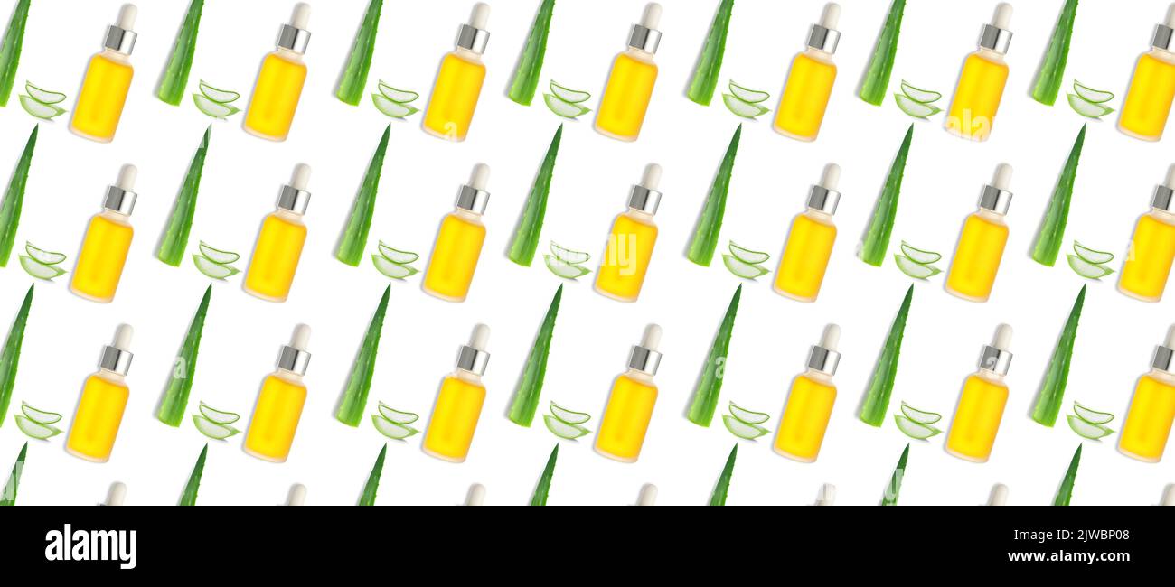 Many bottles of aloe vera essential oil on white background. Pattern ...