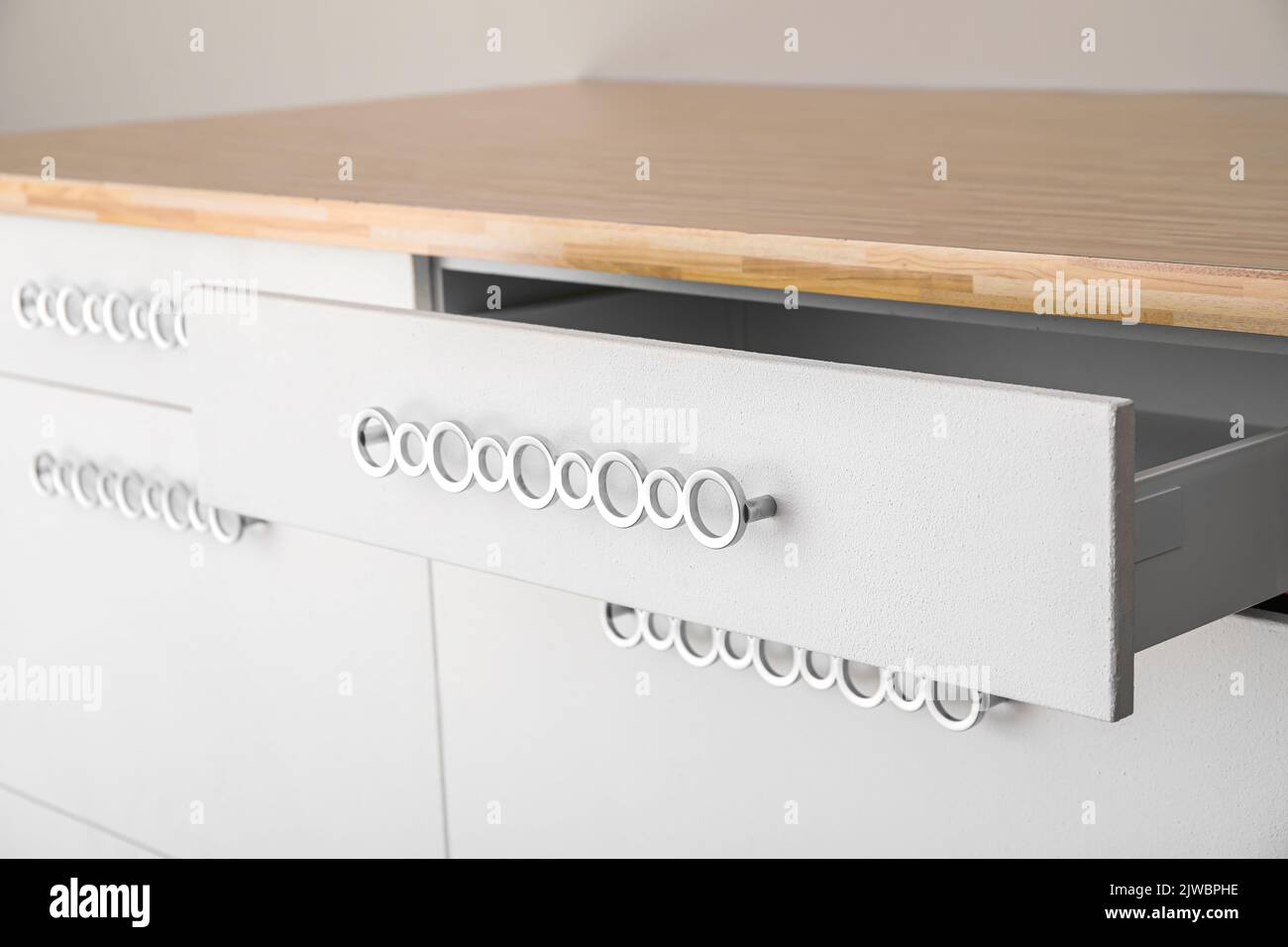 White counter with open drawer in kitchen, closeup Stock Photo - Alamy