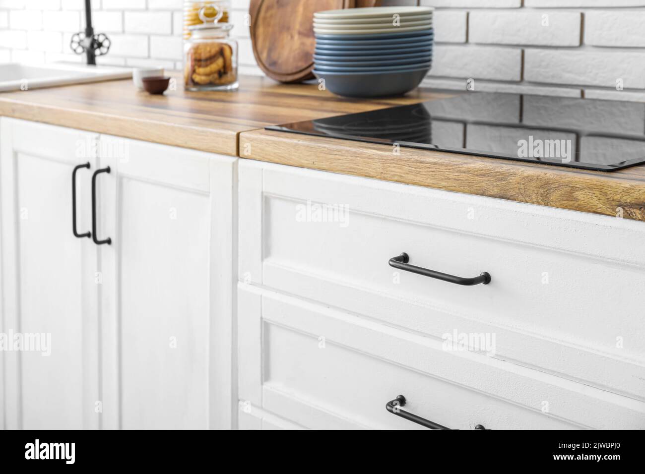 White counters with drawers in kitchen Stock Photo - Alamy