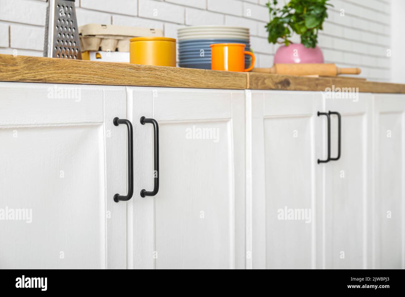 White counters with drawers in kitchen, closeup Stock Photo - Alamy