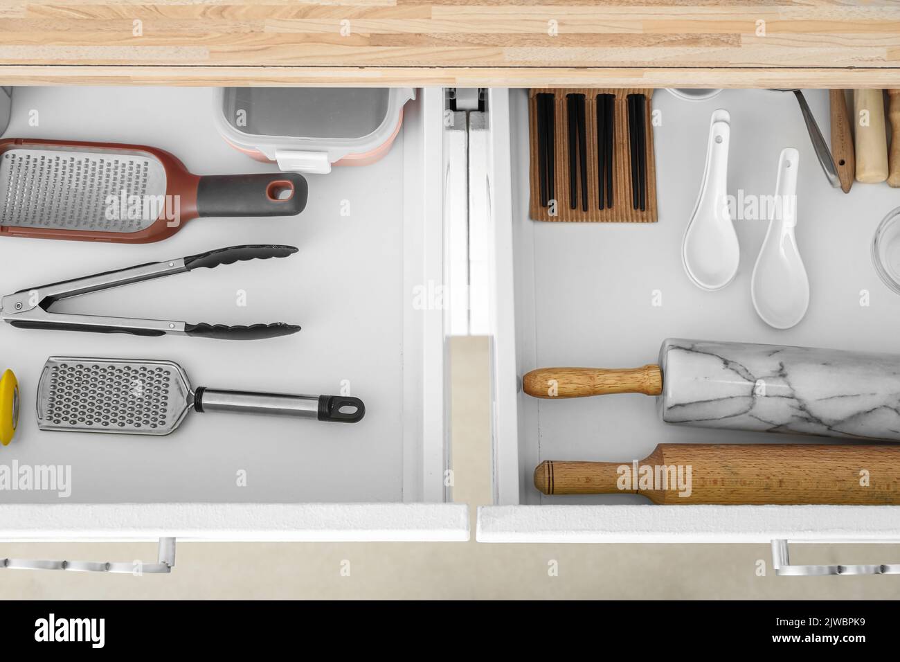 Open drawer with utensils in kitchen, closeup Stock Photo - Alamy