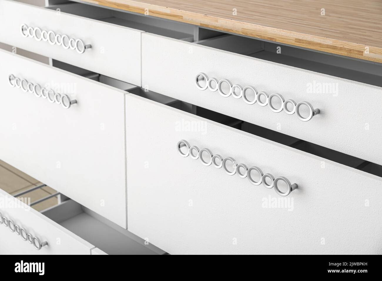 Open empty drawers in kitchen, closeup Stock Photo - Alamy