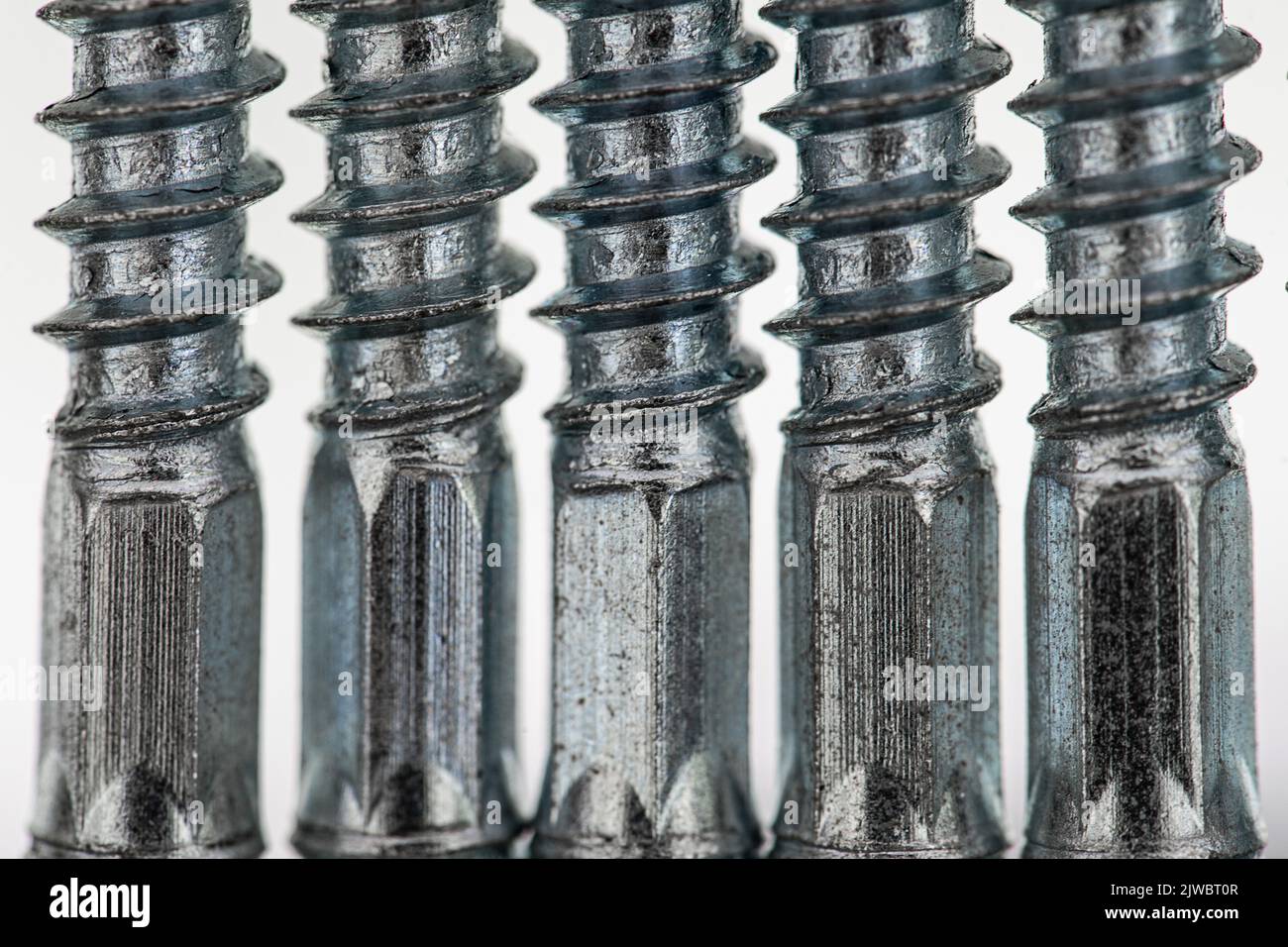 Screws with hexagonal shaft in a row of five. Close up. Grey color of ...