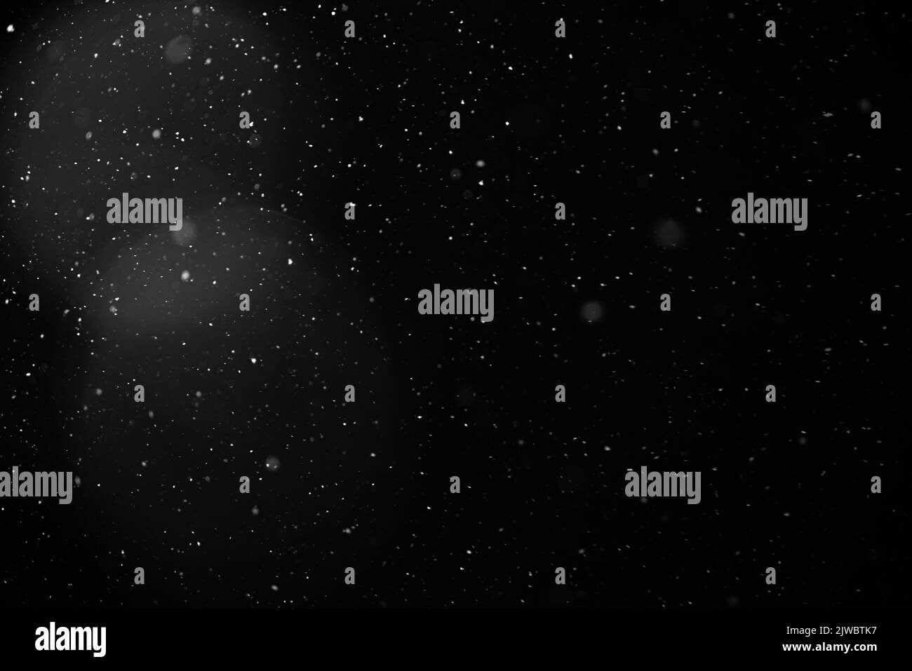 Snowflakes falling down on black background, heavy snow flakes isolated ...