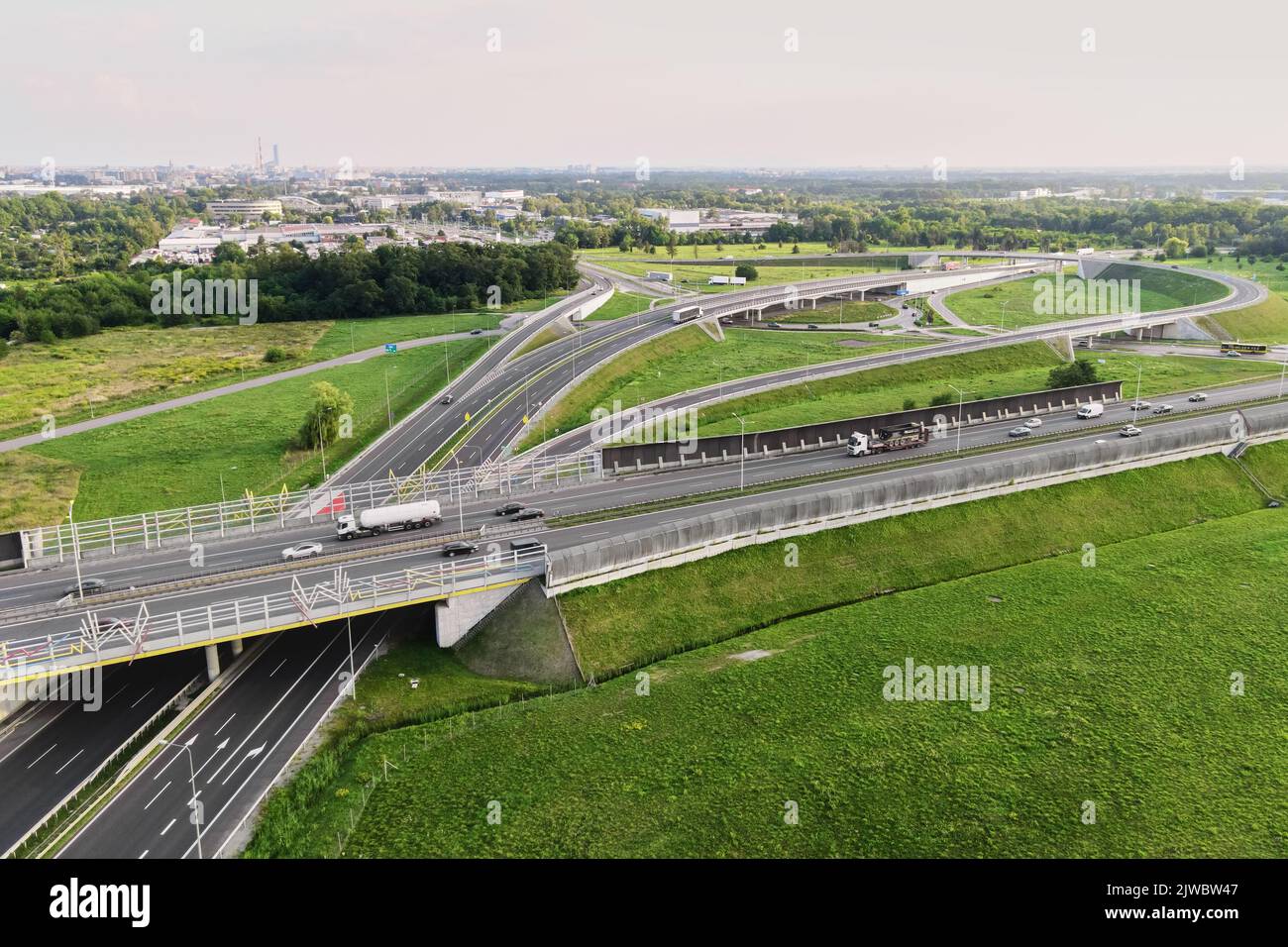 Aerial view of cars driving on round intersection in city ...