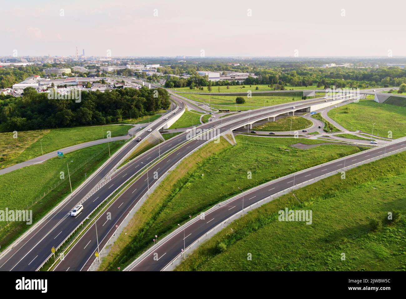 Aerial view of cars driving on round intersection in city ...