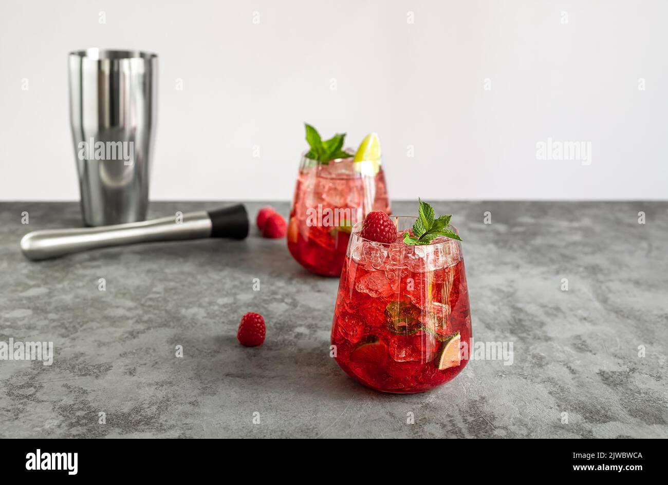 Raspberry daiquiri, alcoholic cocktail with raspberry, white rum, lime juice, and crushed ice ...