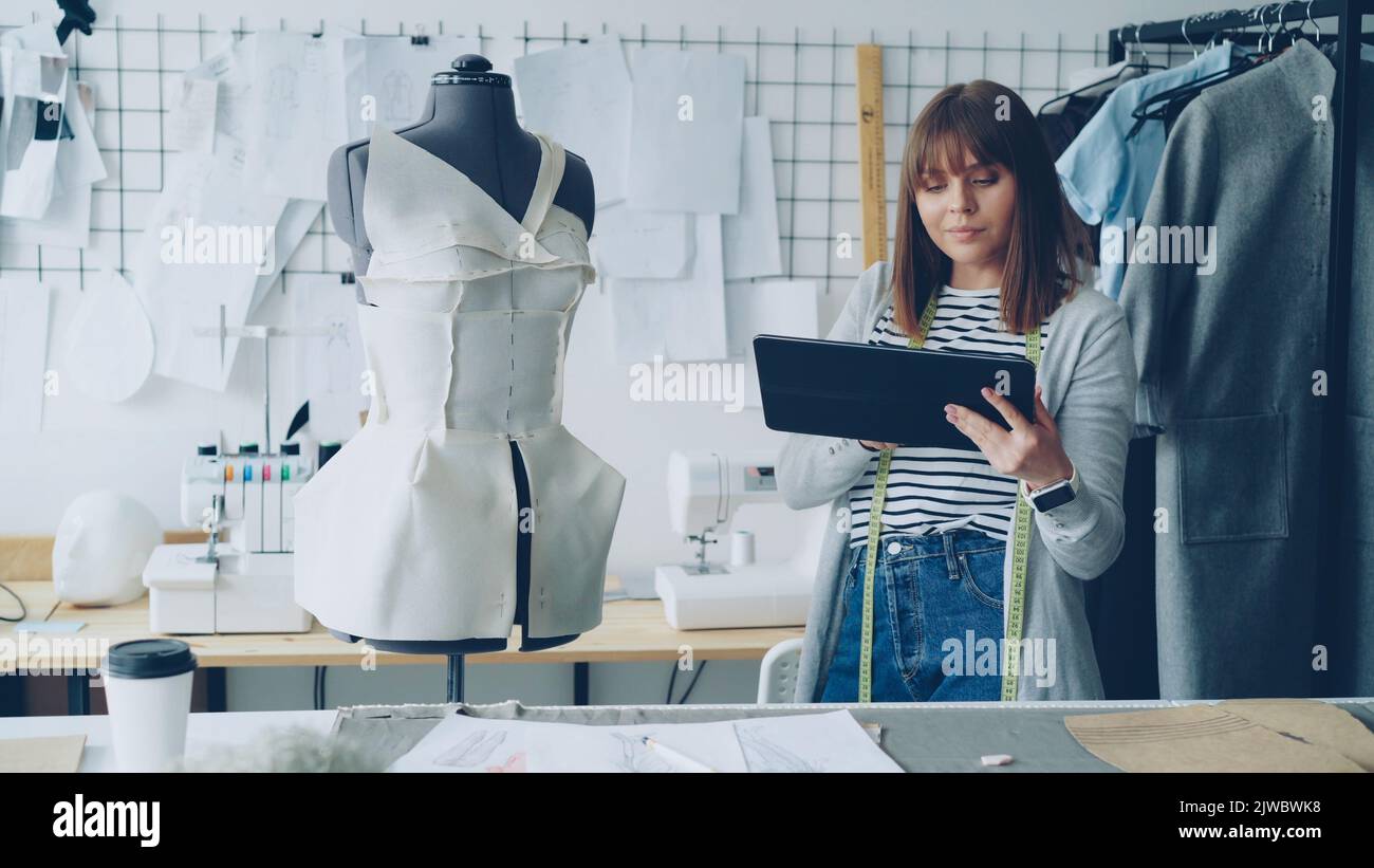Beautiful tailor turning tailoring dummy hi-res stock photography and ...