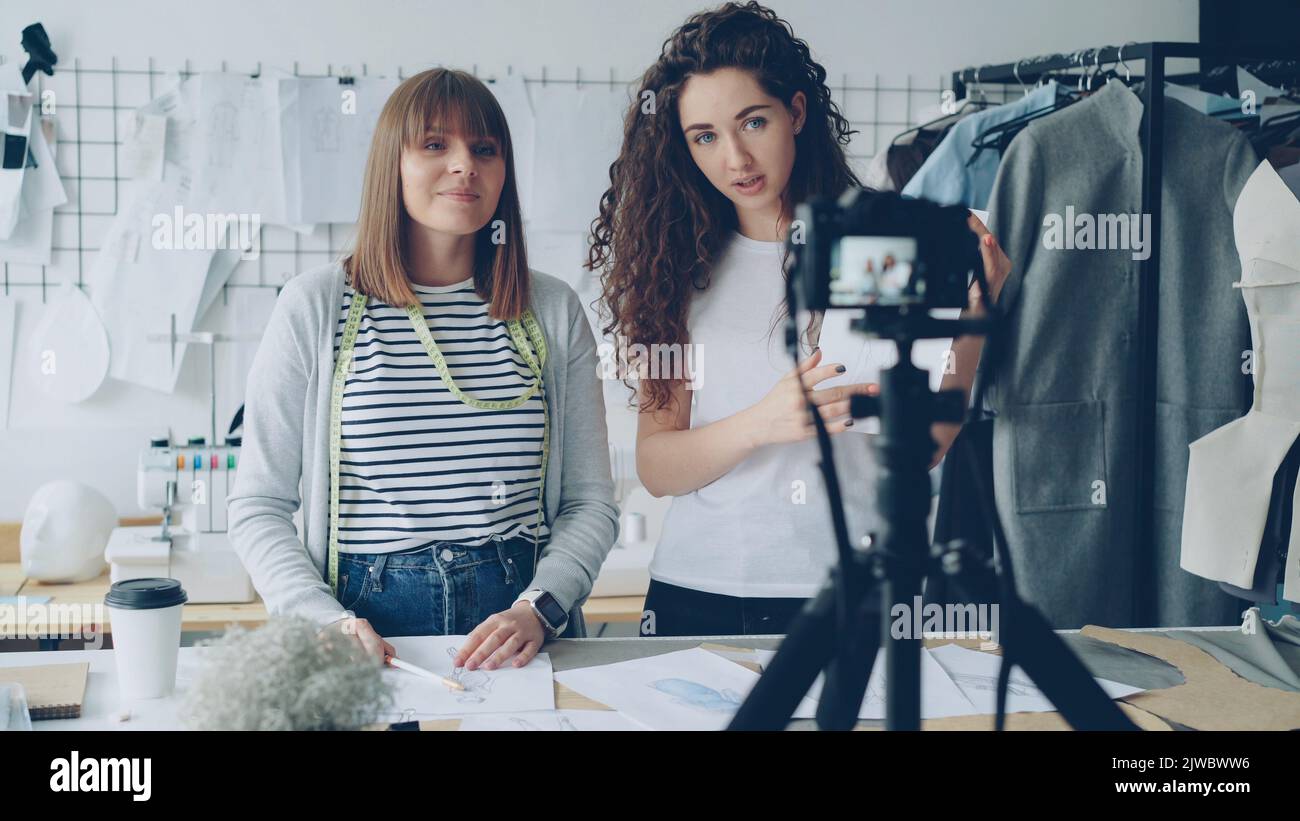 Young pretty women fashion designers bloggers are recording video with ...