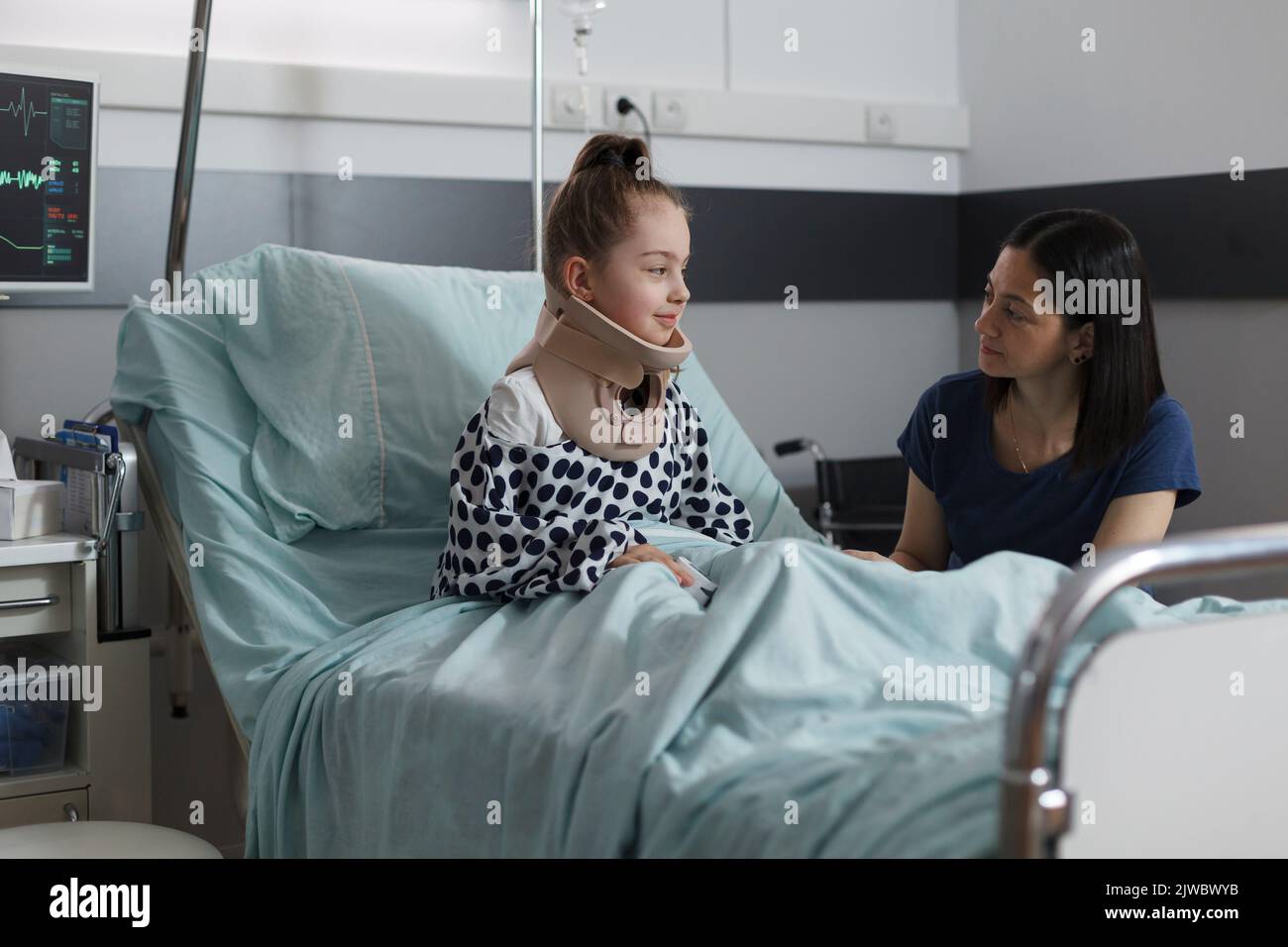 Neck injured hospitalized girl with cervical collar resting in hospital ...
