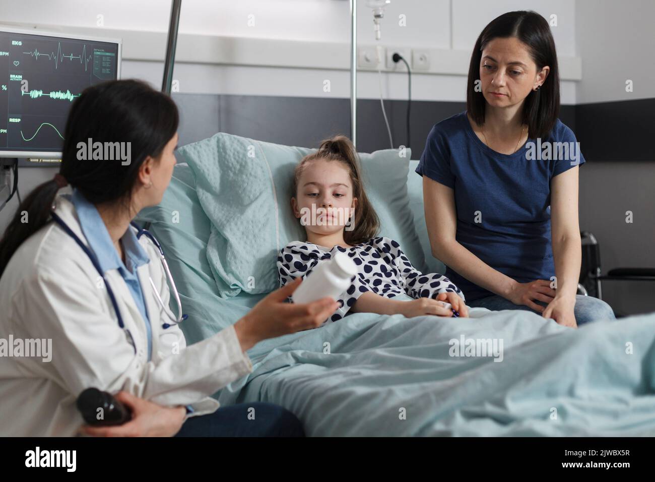 Expert pediatrician prescribing medication for little girl disease ...