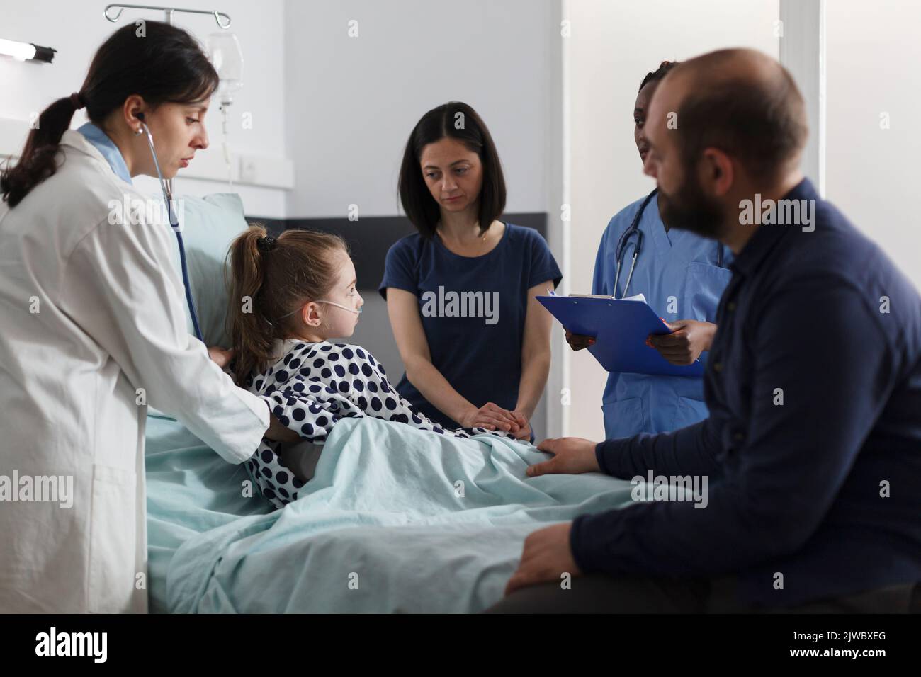 General practitioner consulting ill little girl under treatment inside ...