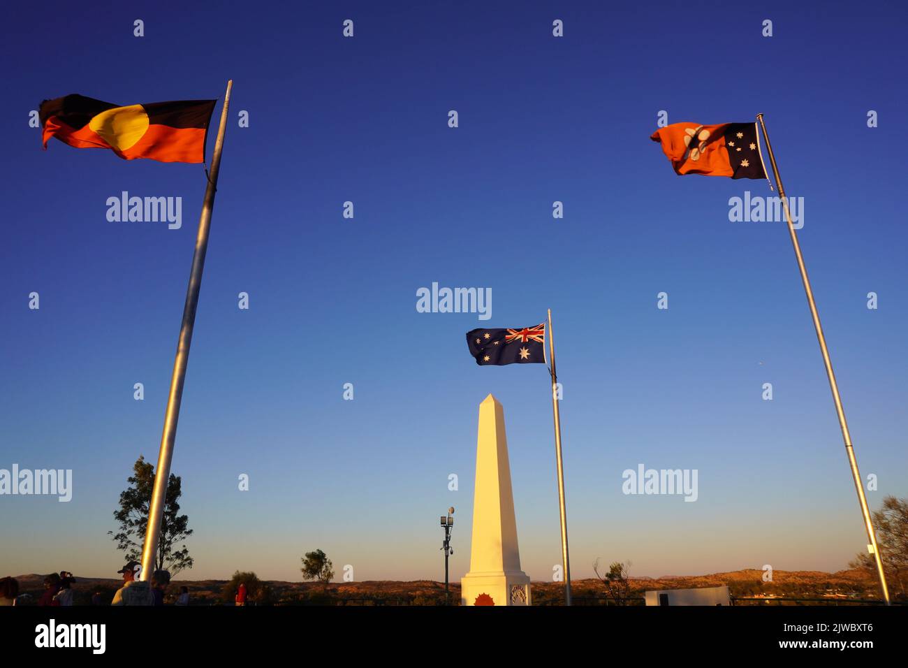 Setting Sun illuminating the Flags on ANZAC Hill, Alice Springs Stock ...