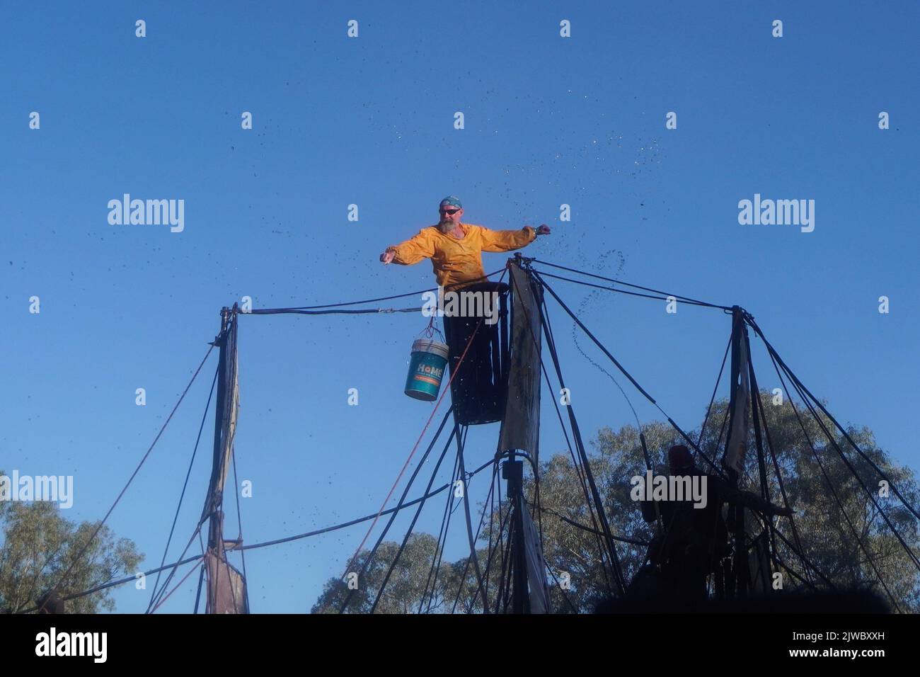 Sailor on Top of a Ship’s Mast throwing Glitter at the 2022 Henley-on ...