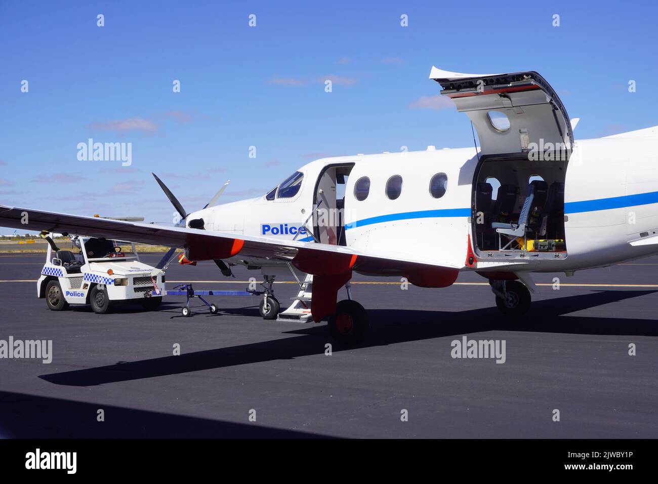 Police Aircraft and Tug on the Apron at Alice Springs Airport Stock ...