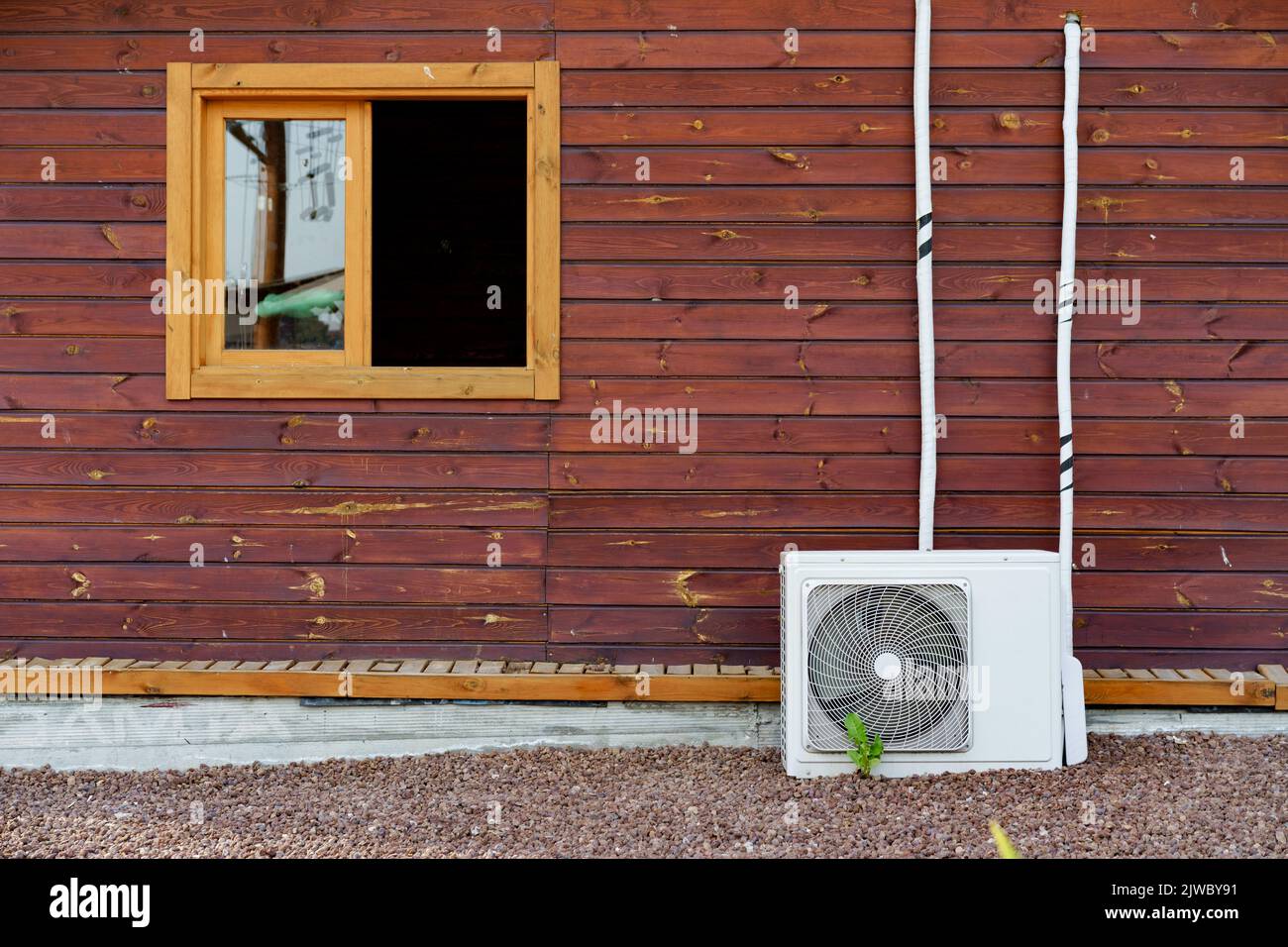 Air conditioner block on wall of building outdoors Stock Photo - Alamy