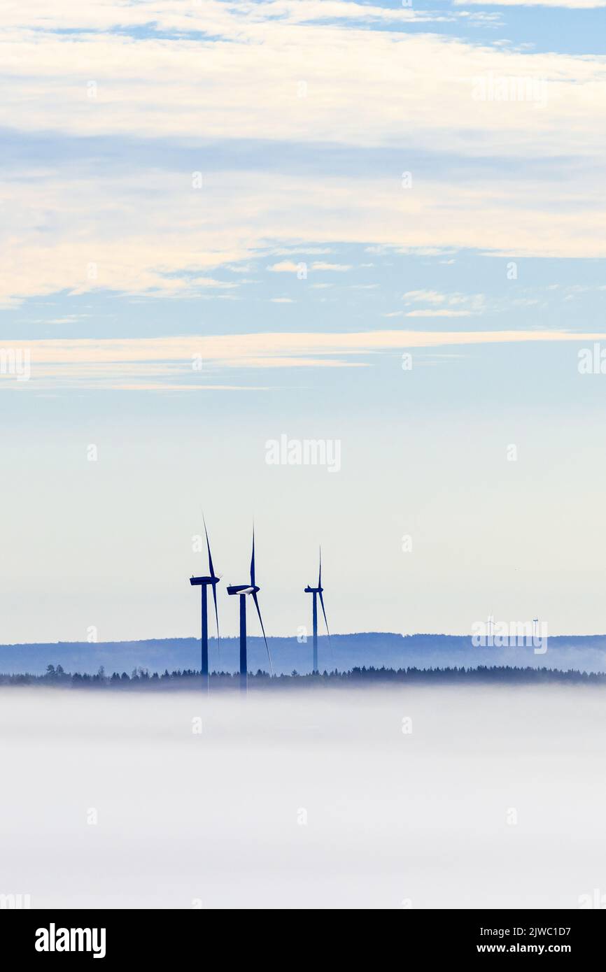 Fog in a rolling landscape with wind turbines Stock Photo - Alamy